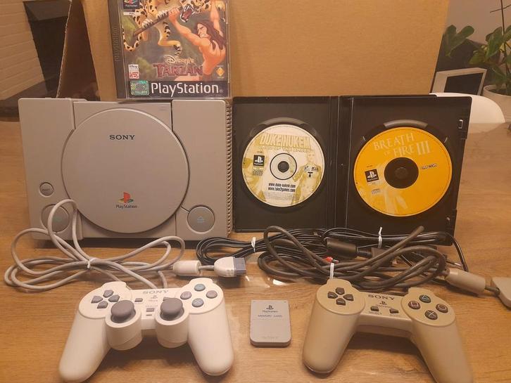 ② Playstation 1 + 2 manettes + câbles + carte mémoire + 3 jeux ...